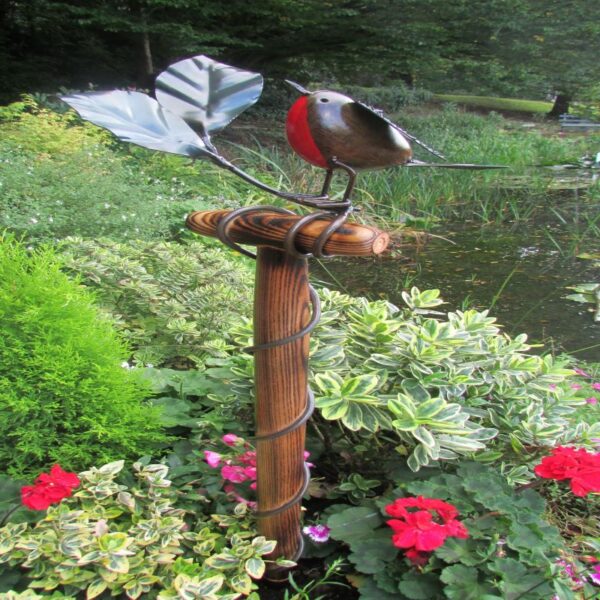 A robin perched on wooden spade handle | Old Smithy North Lincs