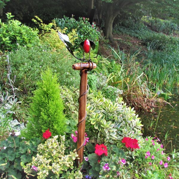 A robin perched on wooden spade handle | Old Smithy North Lincs
