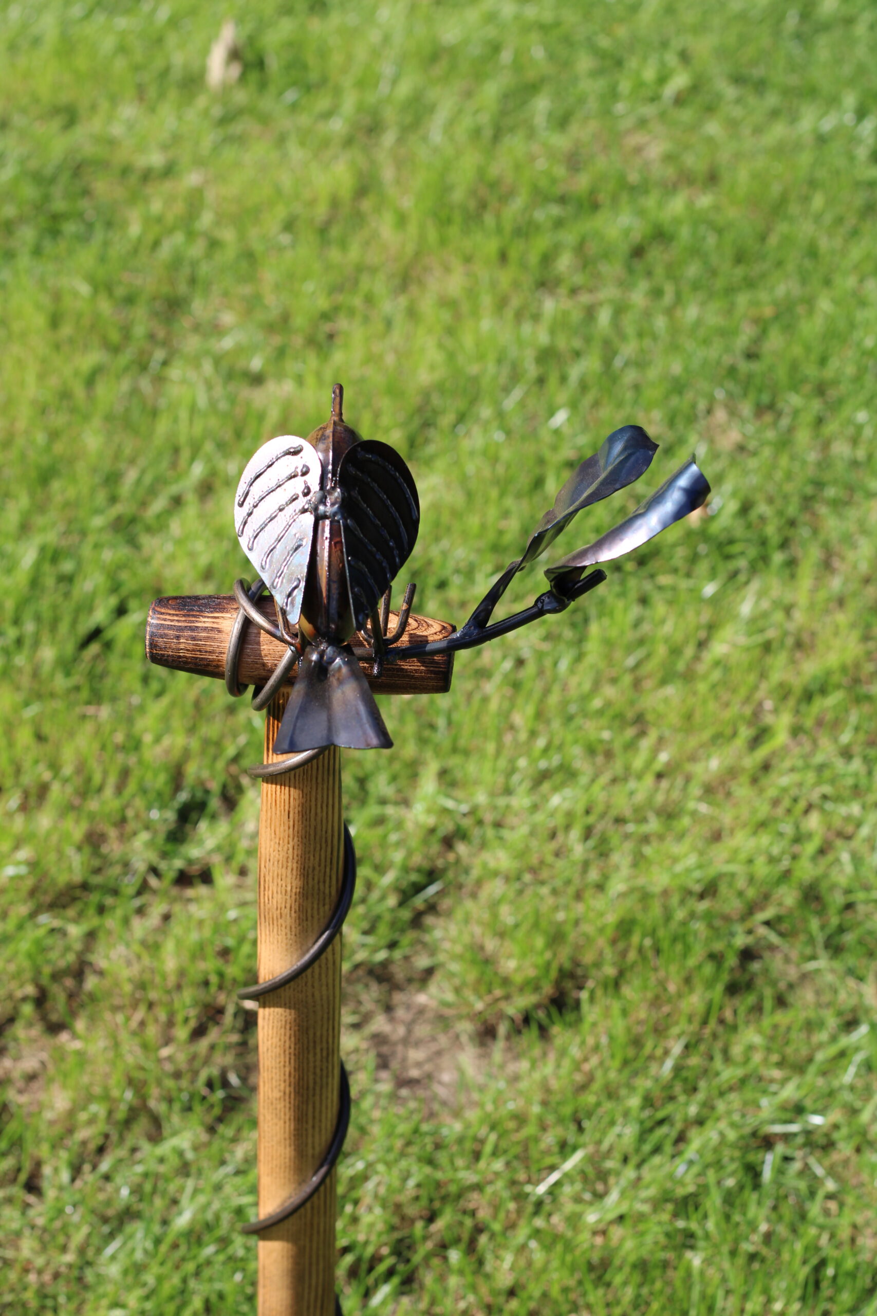 A robin perched on wooden spade handle | Old Smithy North Lincs